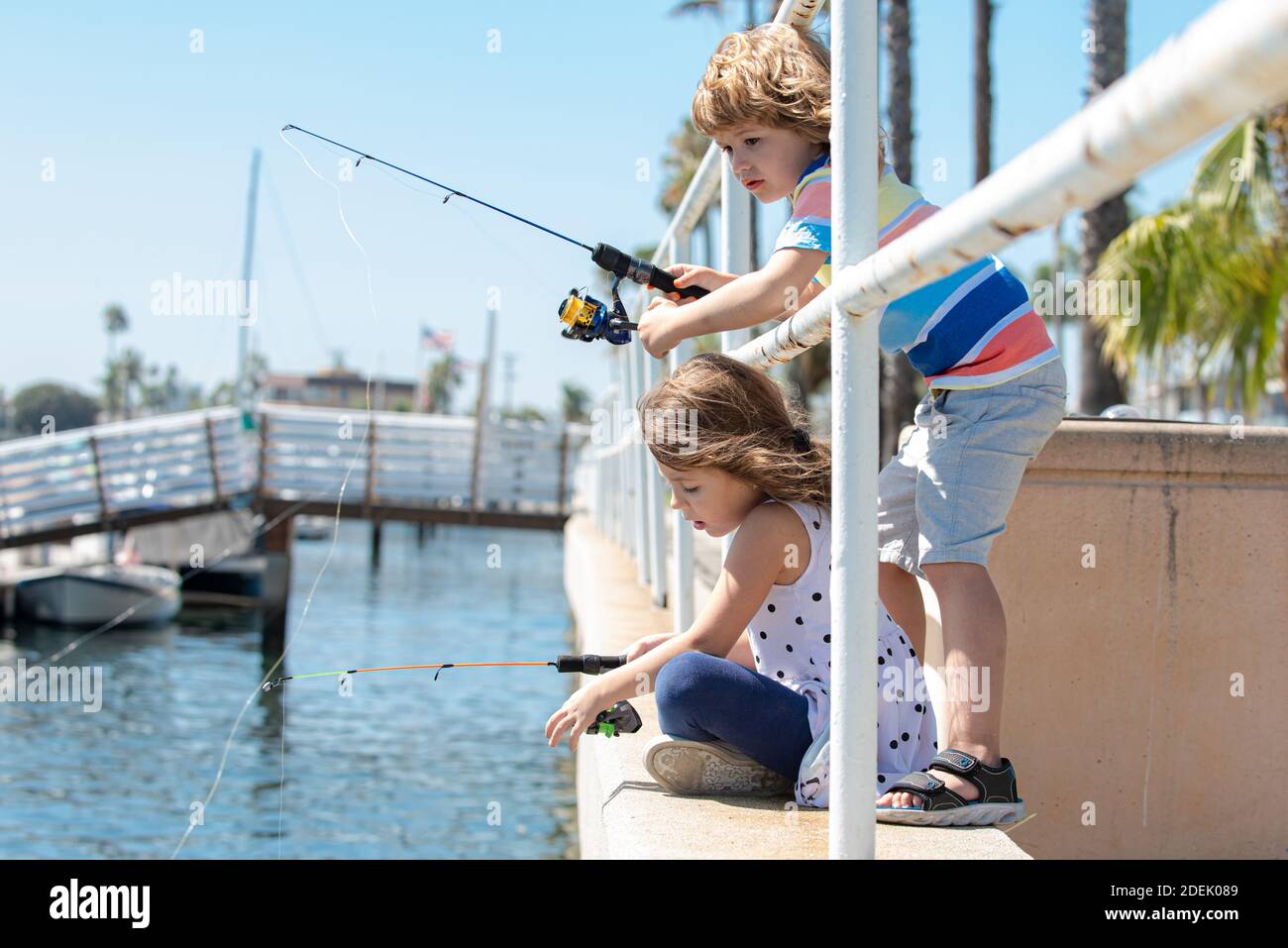 Two children playing on rocks hi-res stock photography and images - Alamy