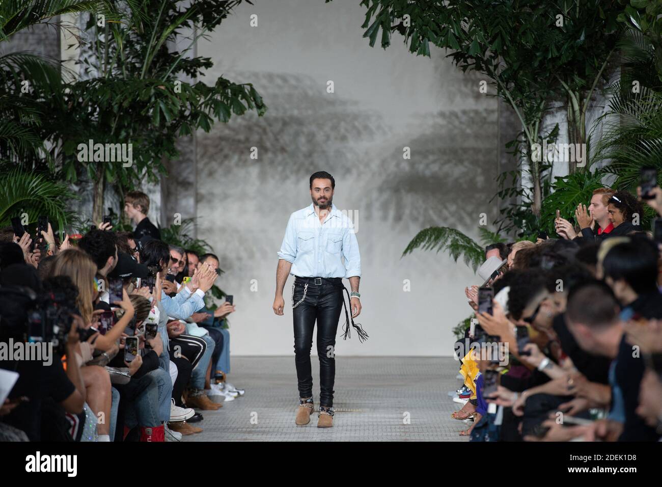 Designer Mike Amiri makes an appearance on the runway during the Amiri ...