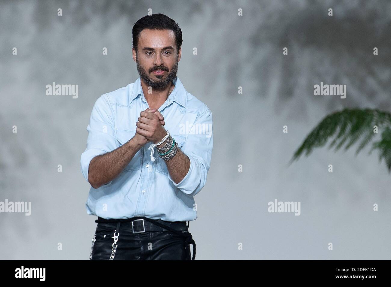 Designer Mike Amiri makes an appearance on the runway during the Amiri ...