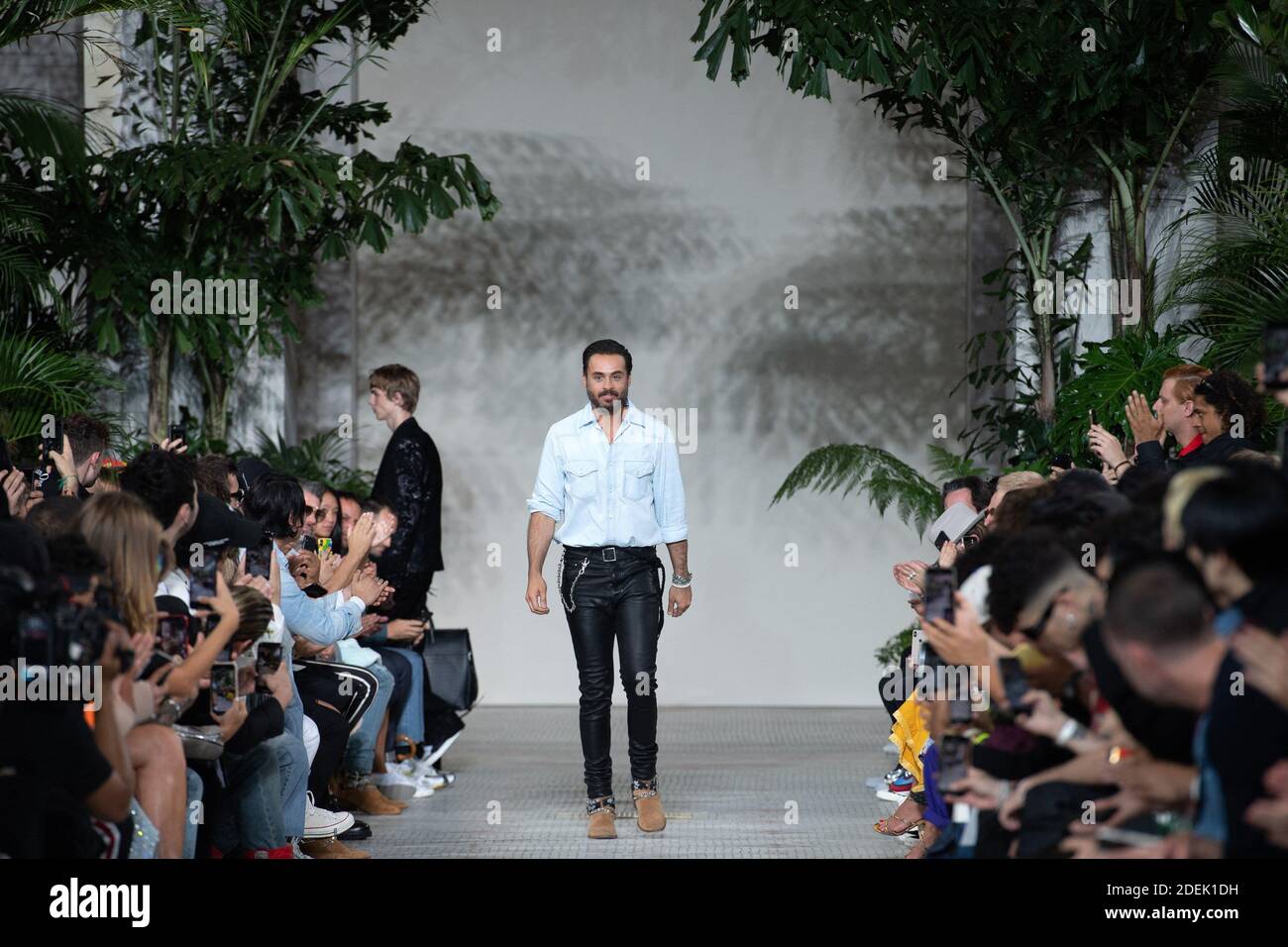 Designer Mike Amiri makes an appearance on the runway during the Amiri ...