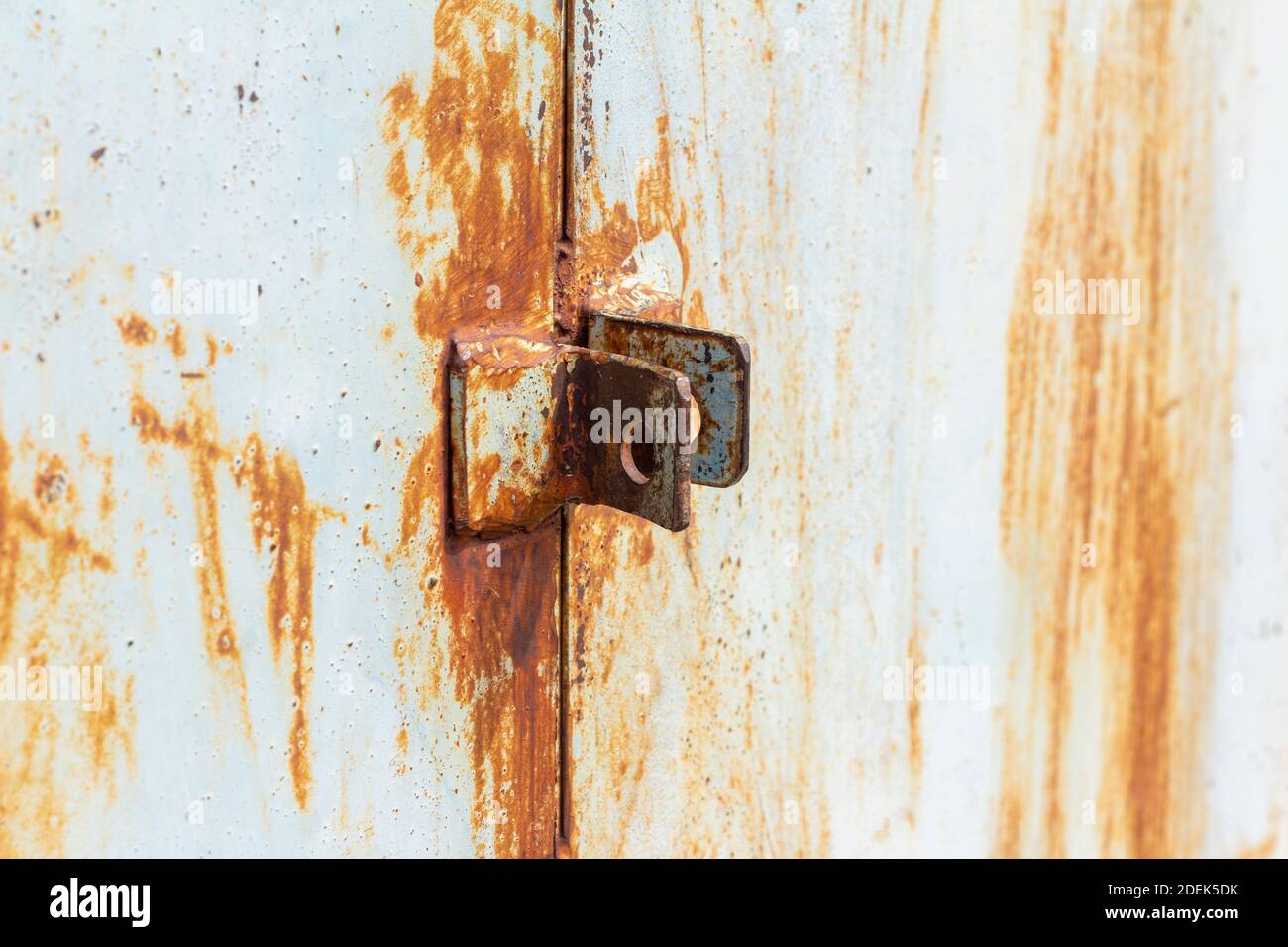Rust.Fragment of a rusty metal door.Rusty hinges for the lock Stock ...
