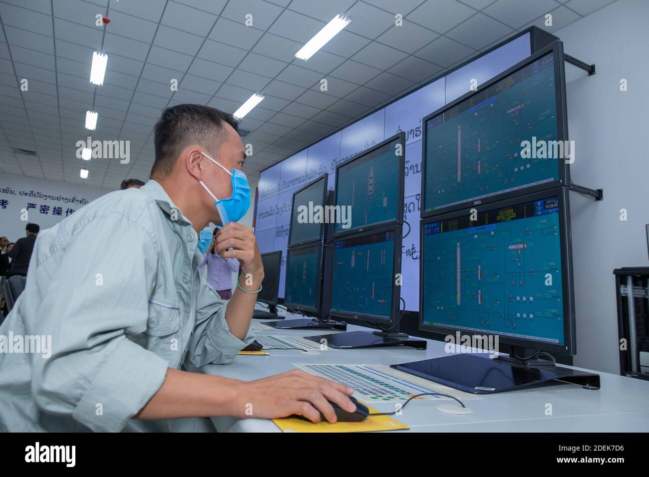 Vientiane, Laos. 30th Nov, 2020. A staff member monitors the refinery's ...