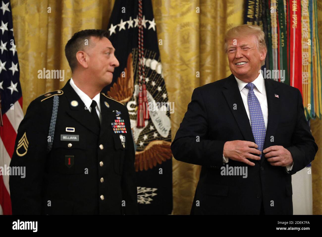 US President Donald Trump winks at Army staff sergeant David G ...