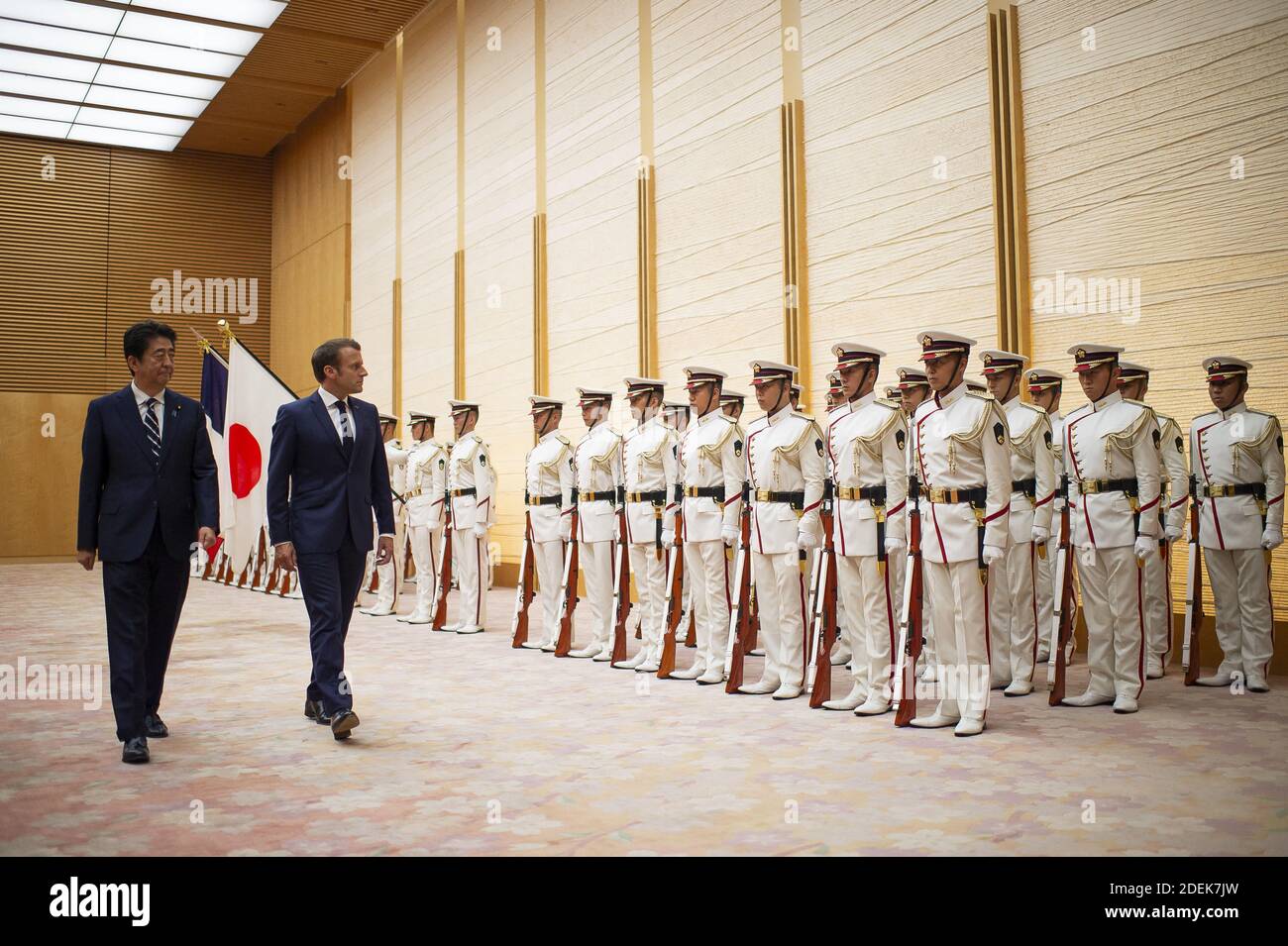 Japanese Prime Minister Shinzo Abe greets French President Emmanuel ...