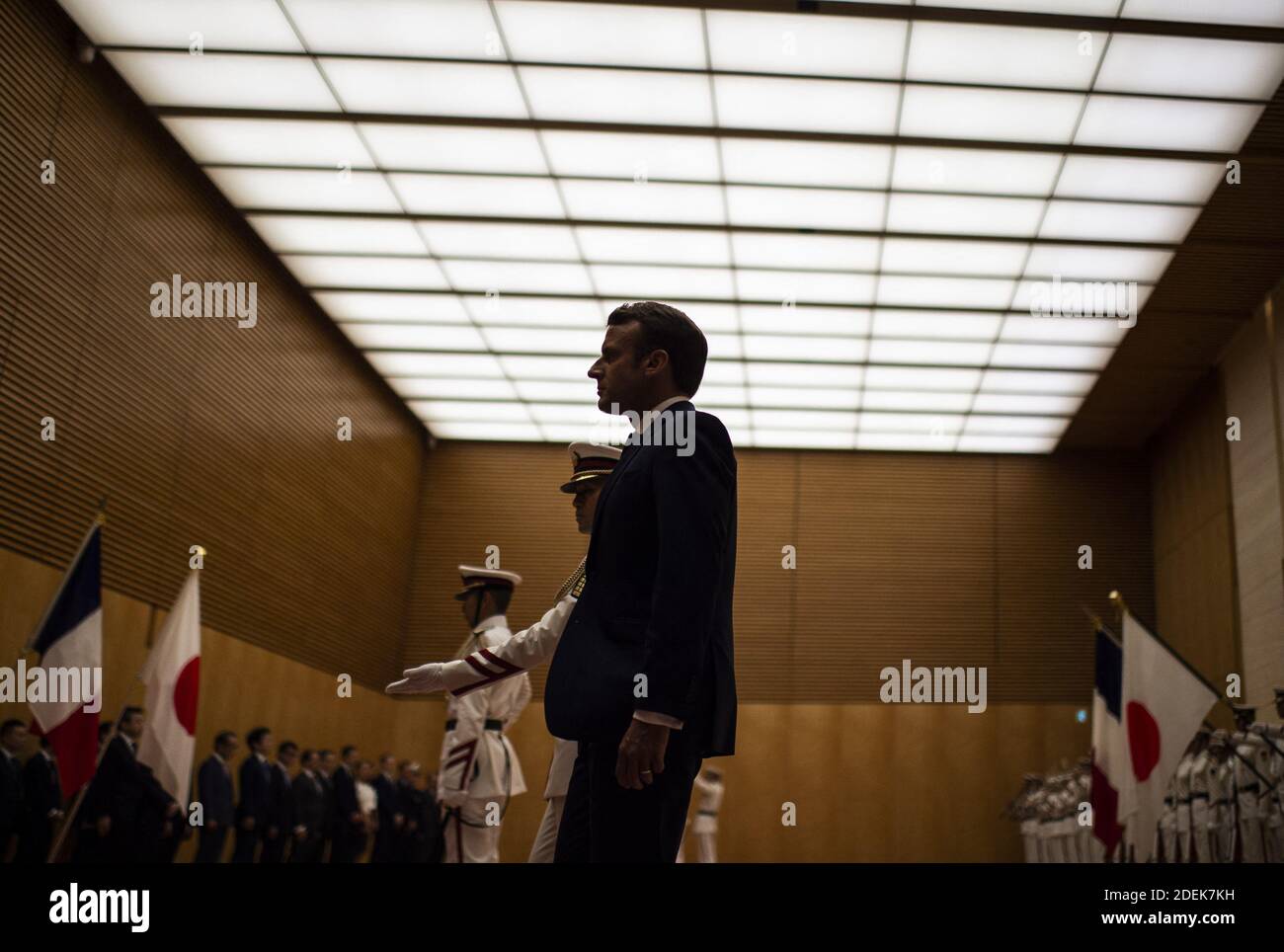 Japanese Prime Minister greets French President Emmanuel Macron during ...