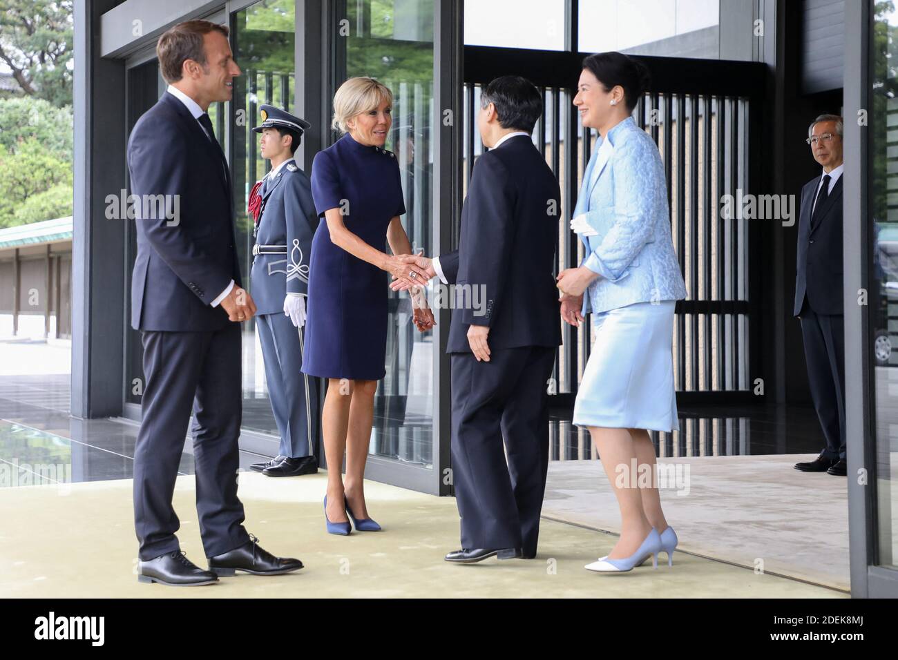 France's President Emmanuel Macron (L) and his wife Brigitte Macron ...