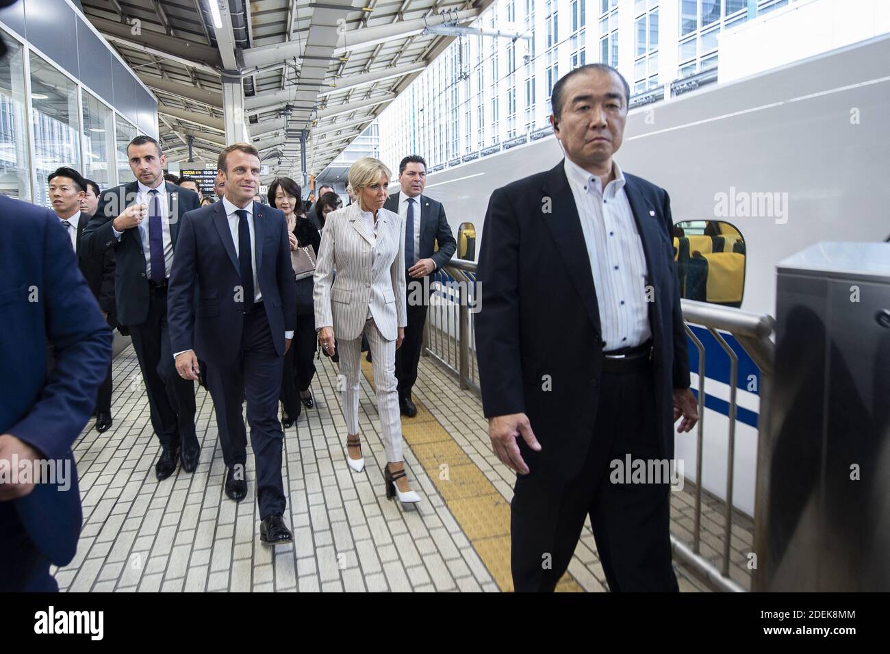 France's President Emmanuel Macron (front L) and his wife Brigitte ...
