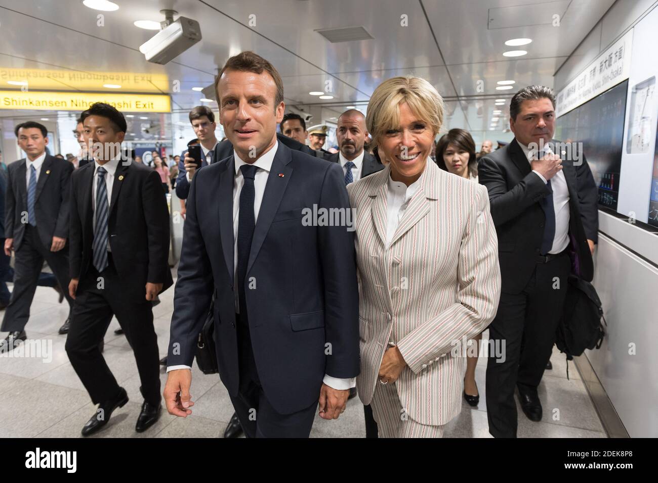 French President Emmanuel Macron and his wife Brigitte Macron walking ...