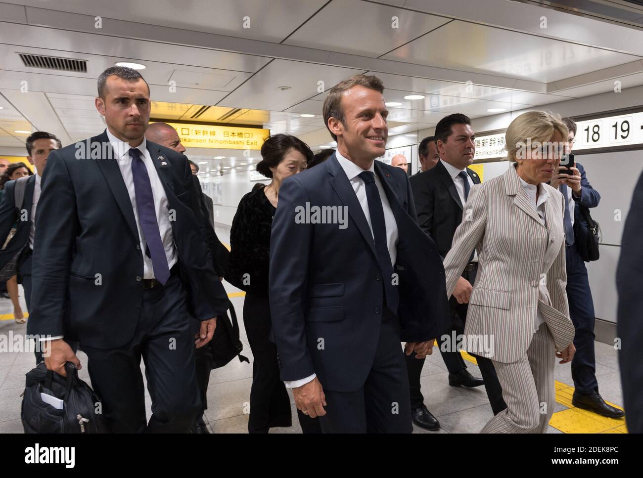 French President Emmanuel Macron and his wife Brigitte Macron walking ...
