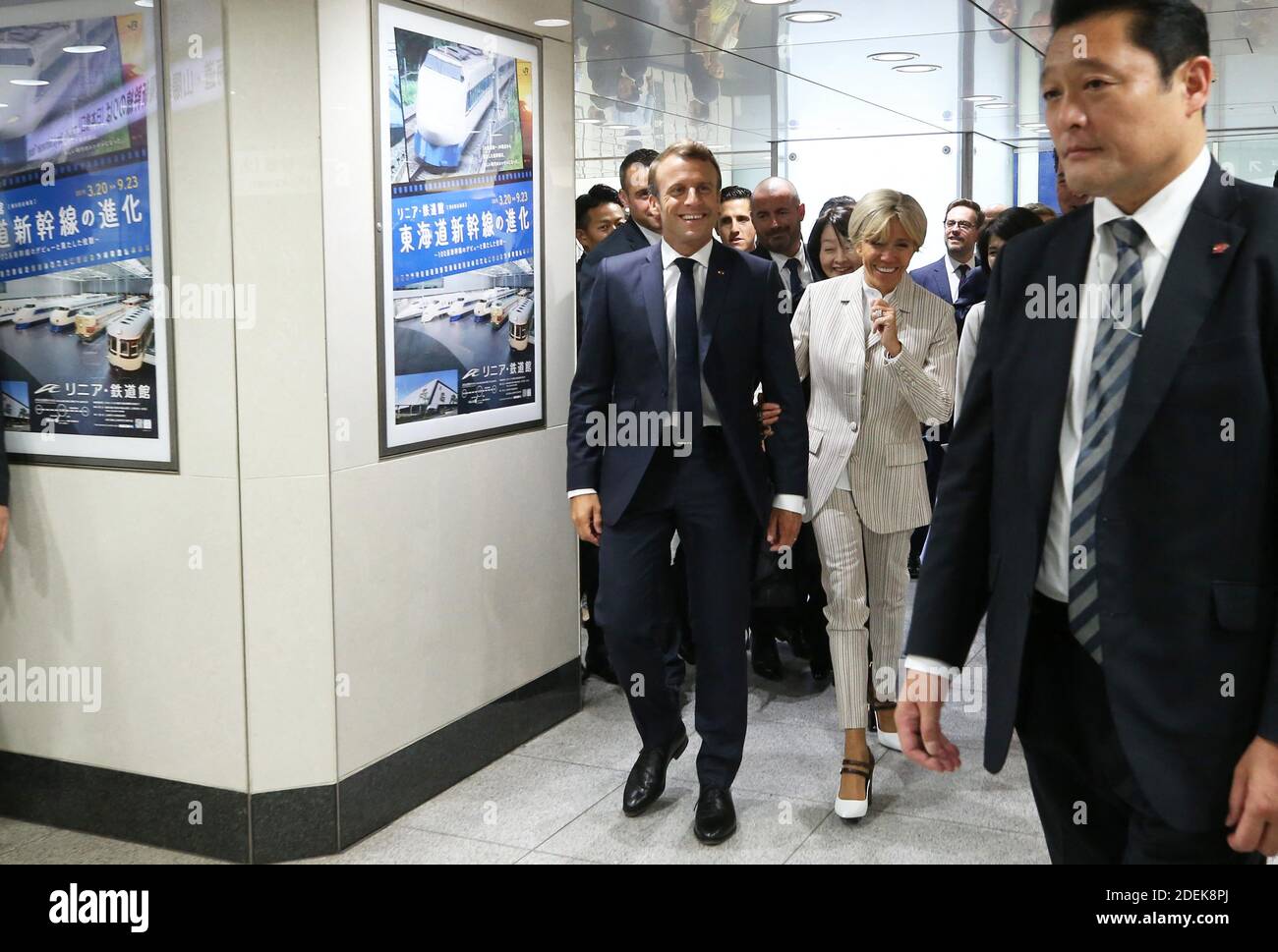 French President Emmanuel Macron and his wife Brigitte Macron walking ...