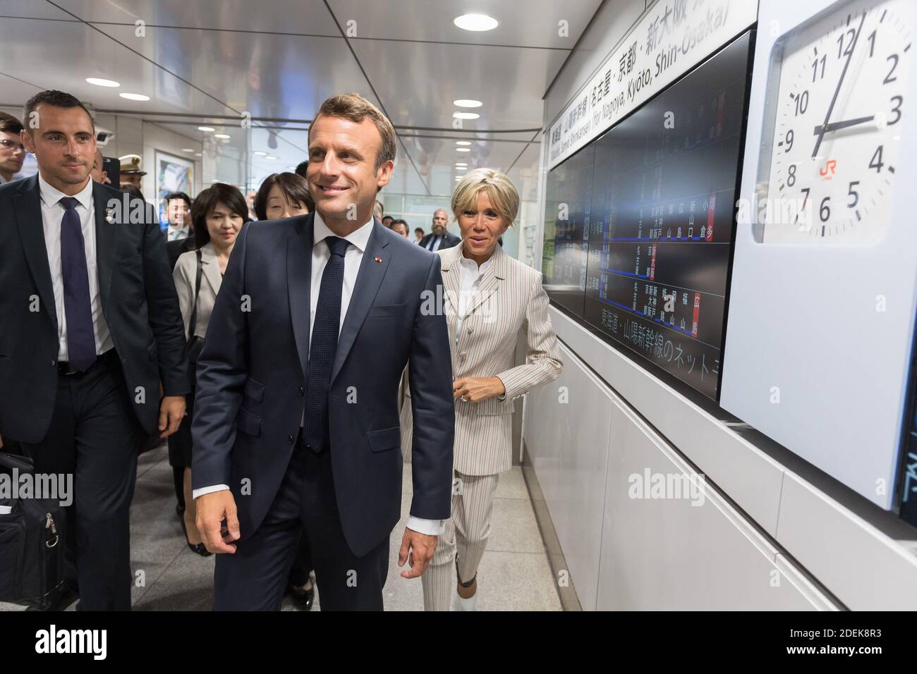 French President Emmanuel Macron and his wife Brigitte Macron walking ...