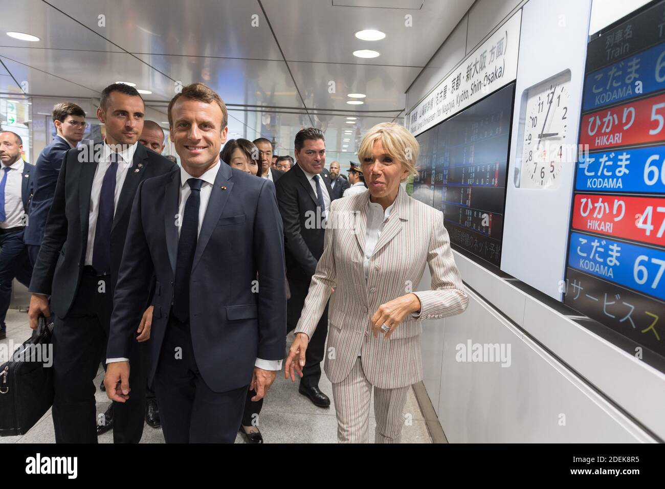 French President Emmanuel Macron and his wife Brigitte Macron walking ...