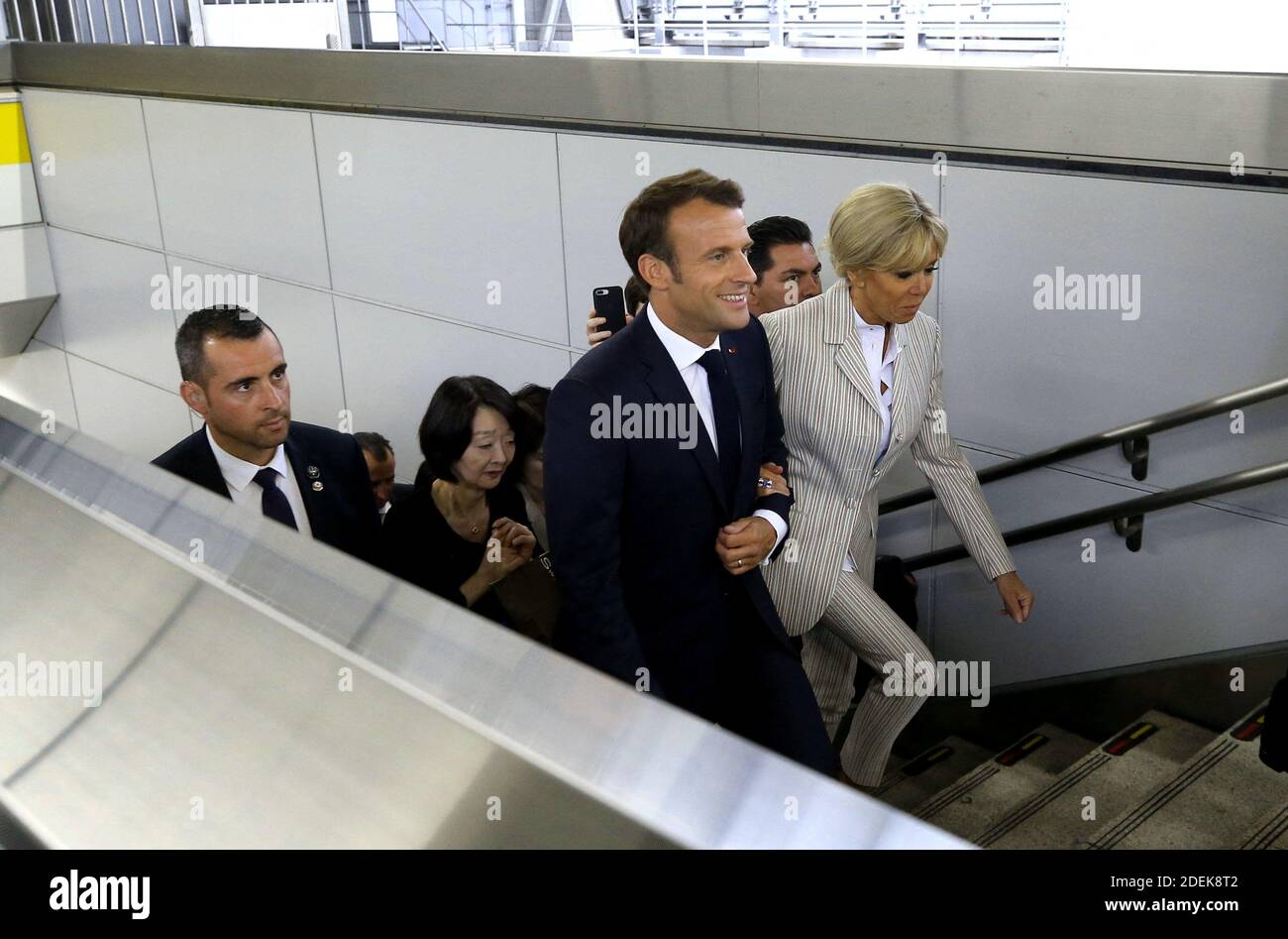 French President Emmanuel Macron and his wife Brigitte Macron walking ...