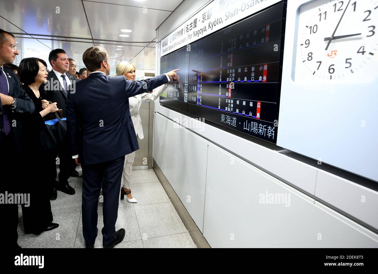 French President Emmanuel Macron and his wife Brigitte Macron walking ...