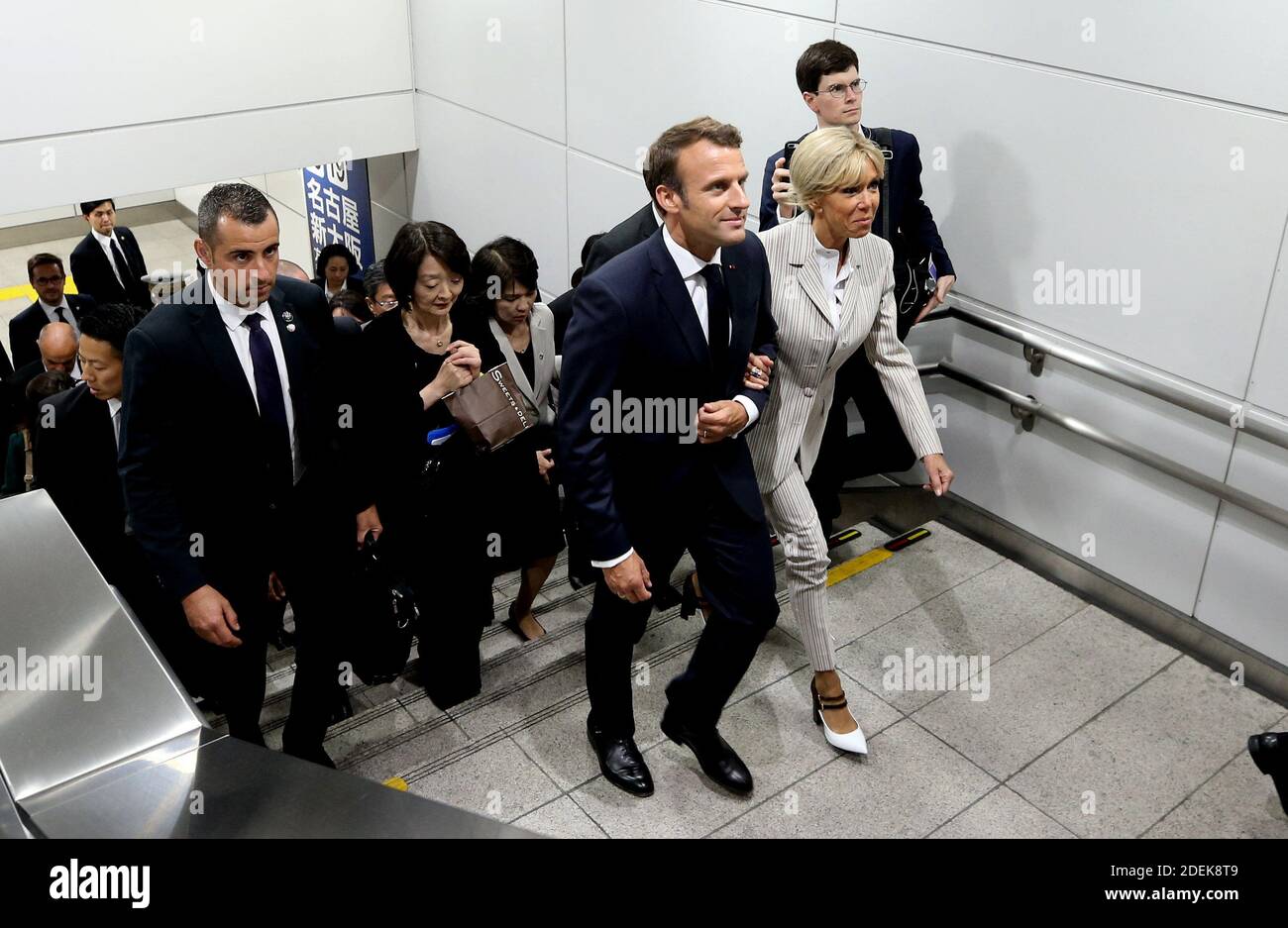 French President Emmanuel Macron and his wife Brigitte Macron walking ...