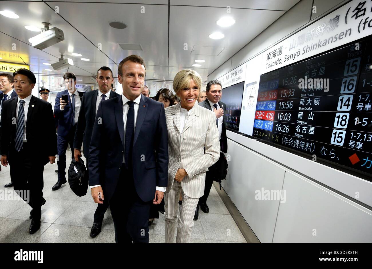 French President Emmanuel Macron and his wife Brigitte Macron walking ...