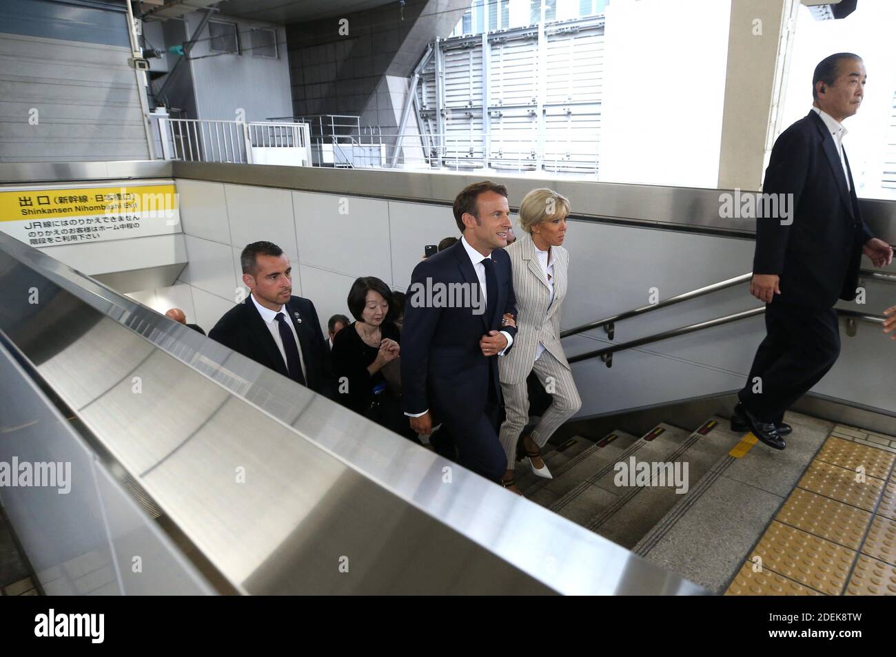 French President Emmanuel Macron and his wife Brigitte Macron walking ...