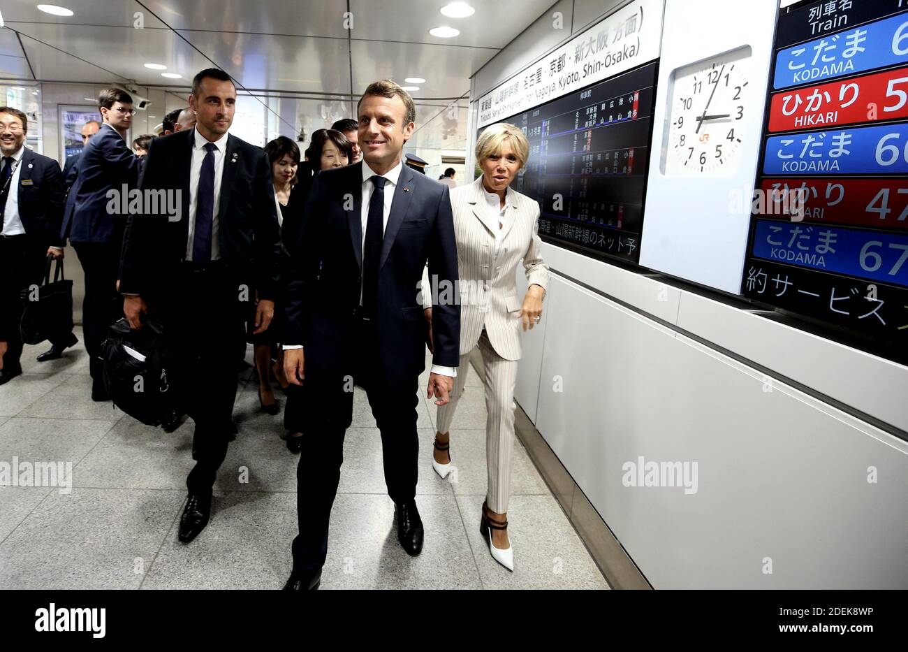 French President Emmanuel Macron and his wife Brigitte Macron walking ...