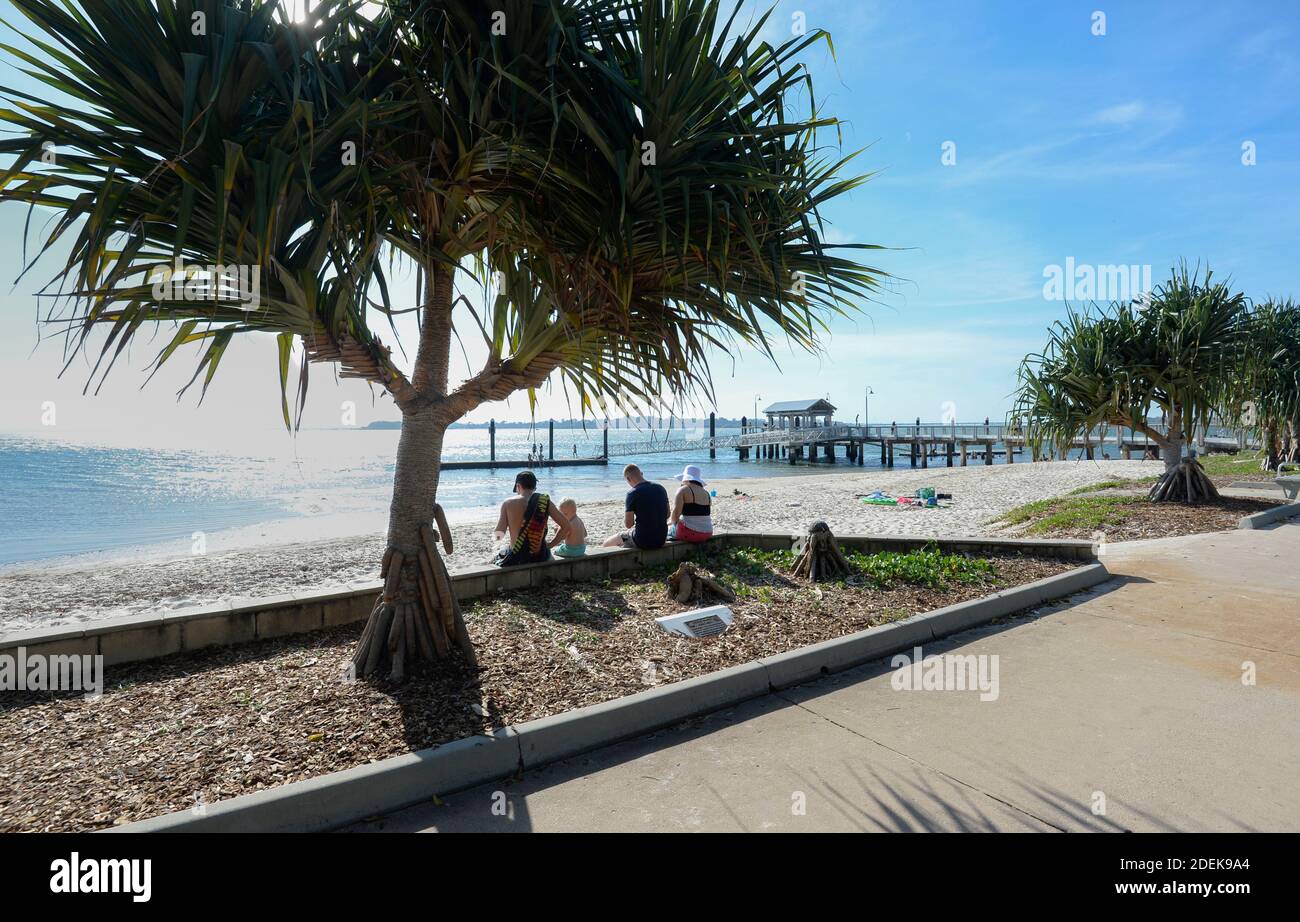 People relaxing on the seafront at popular Bongaree Beach, Bribie Island, Sunshine Coast ...