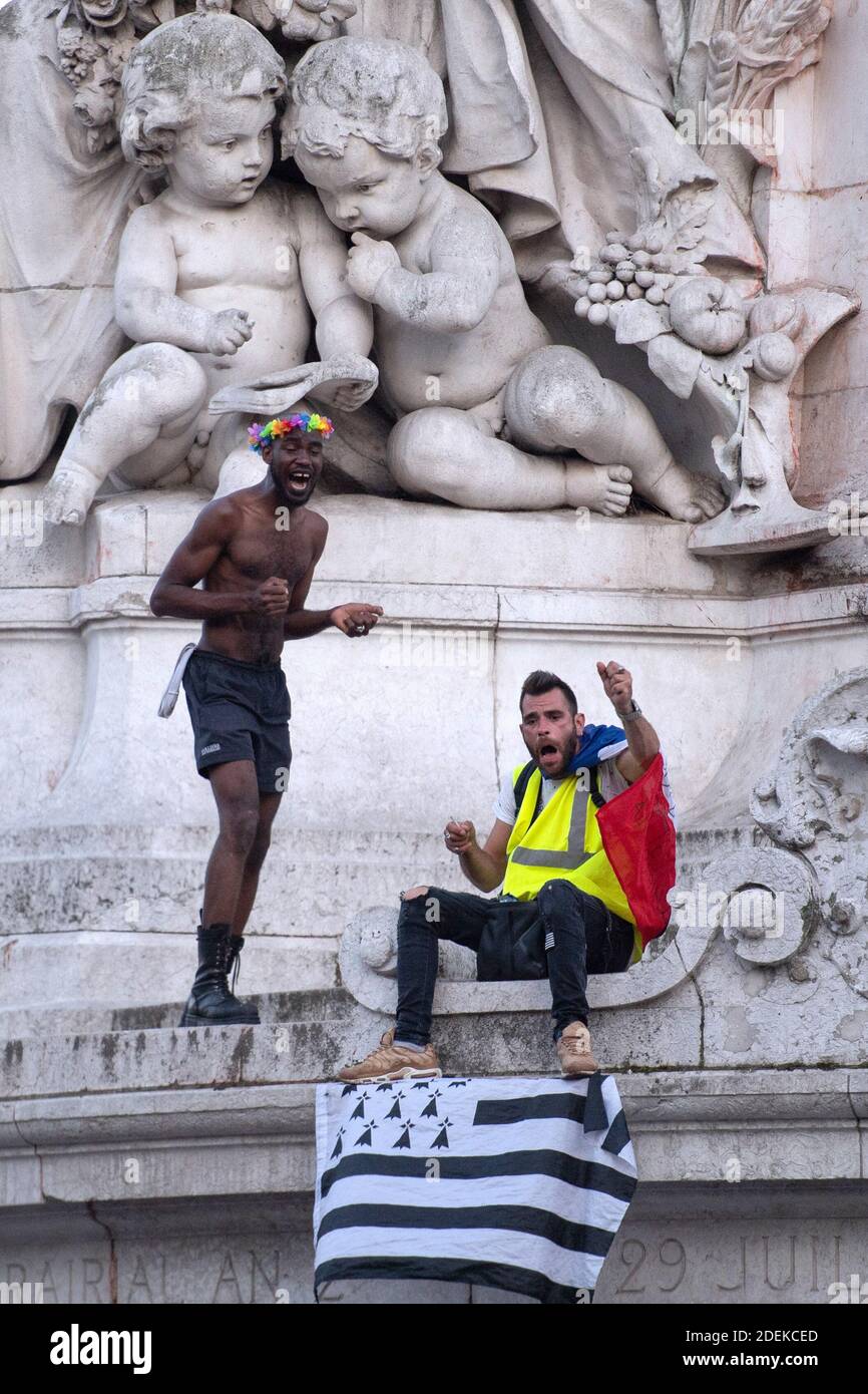 People gather in the streets of Paris to celebrate the annual Gay Pride ...