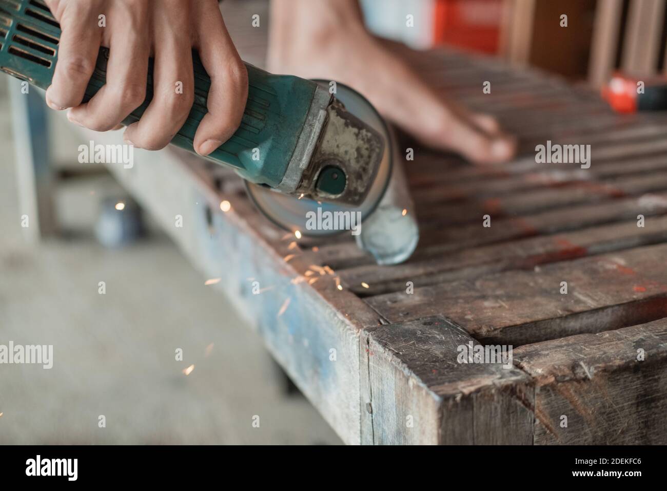 close up of mechanical hands using grinding machines to smooth the ...