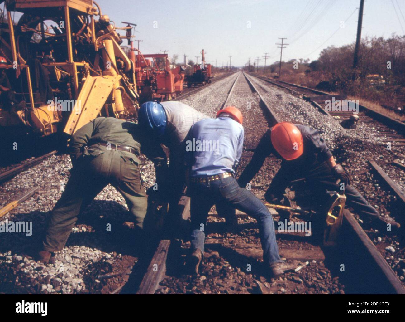 Southern Railway right-of-way work crew jack up a rail they are ...