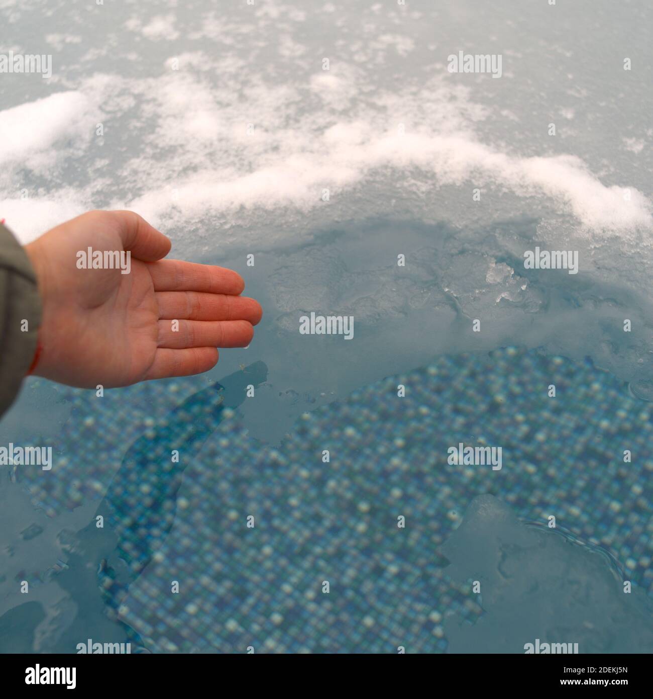 closeup of a hand with red skin about to touch cold water in pool Stock ...