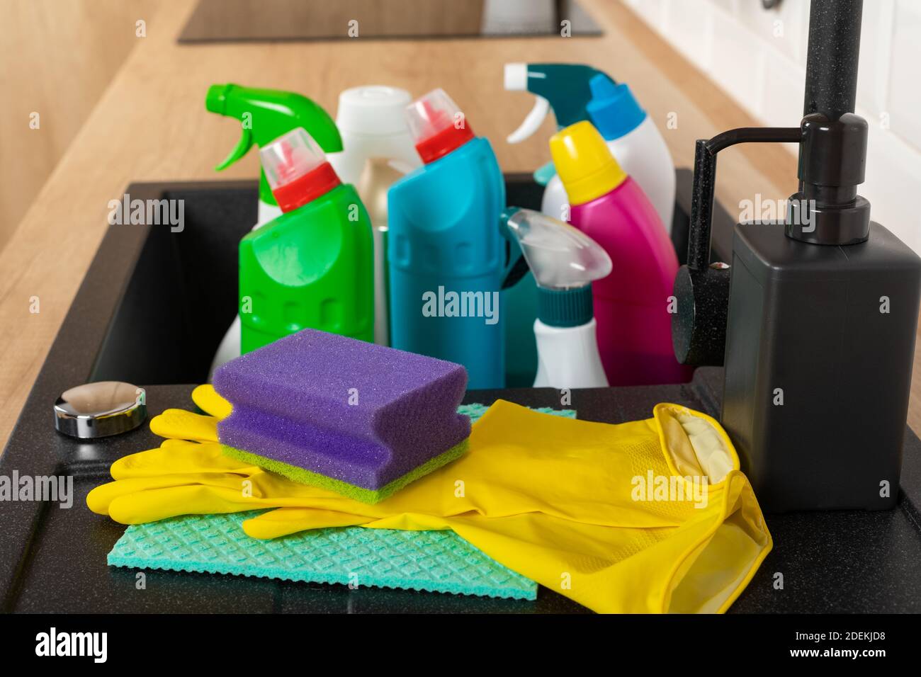 Colorful cleaning products in the kitchen Stock Photo - Alamy