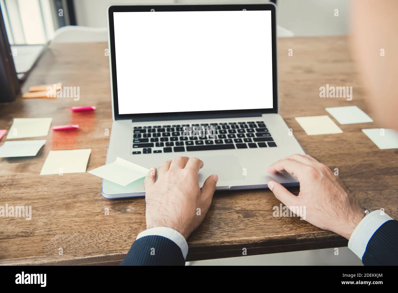 Laptop computer with blank empty screen being used by a businessman at ...