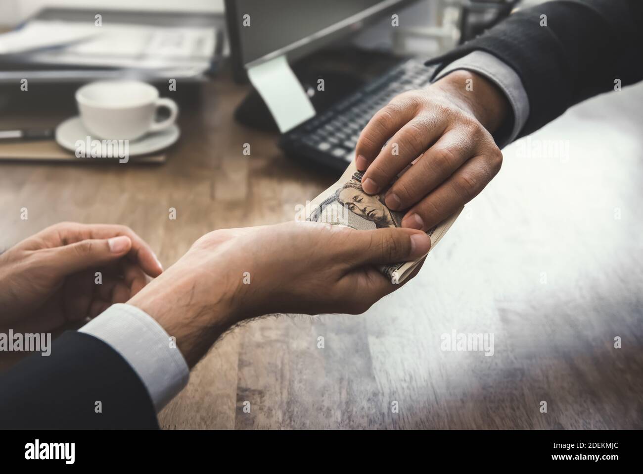 Rich businessman giving the japanese yen money banknote to his partner ...