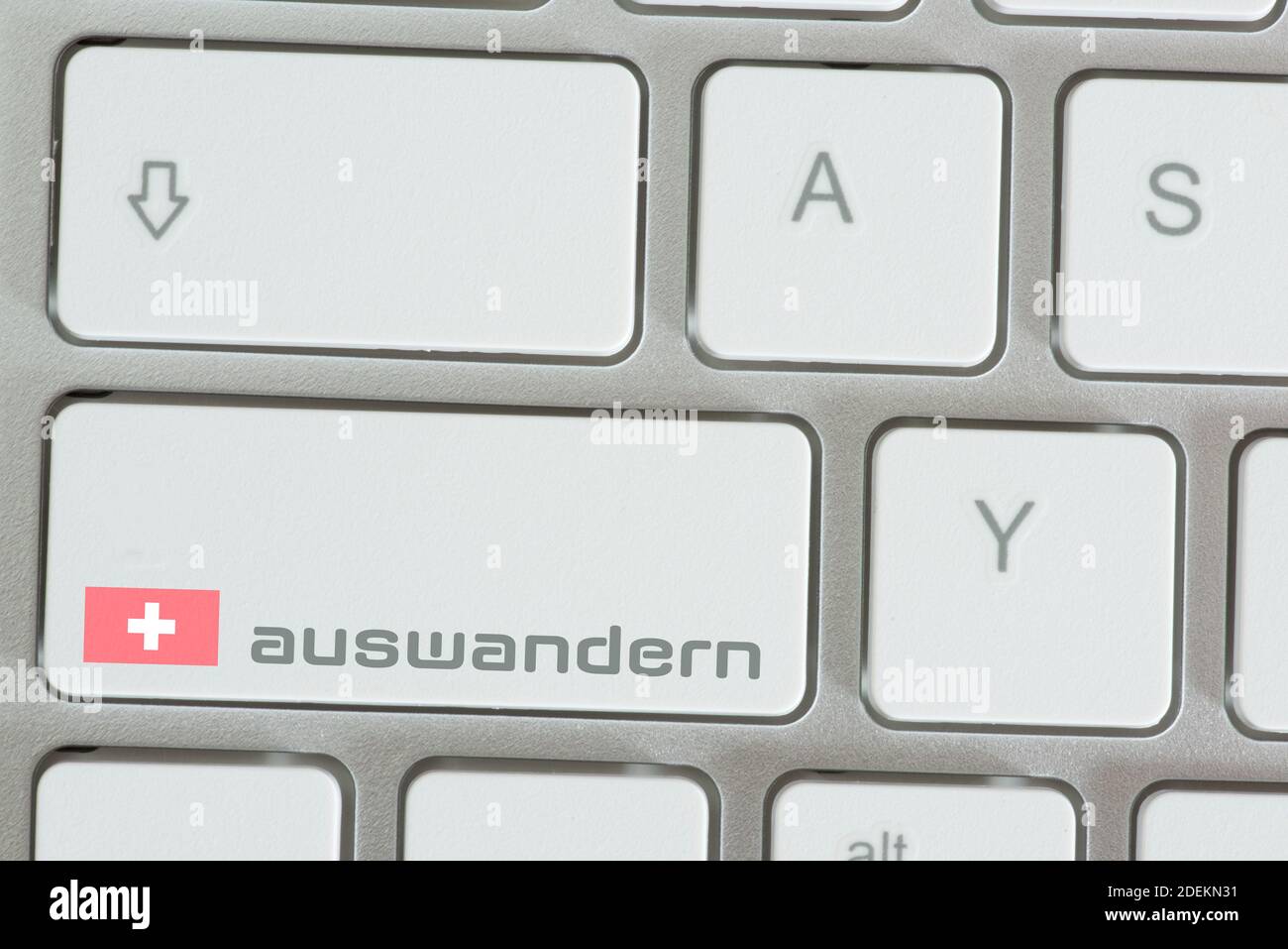 A computer and emigration to Switzerland Stock Photo - Alamy