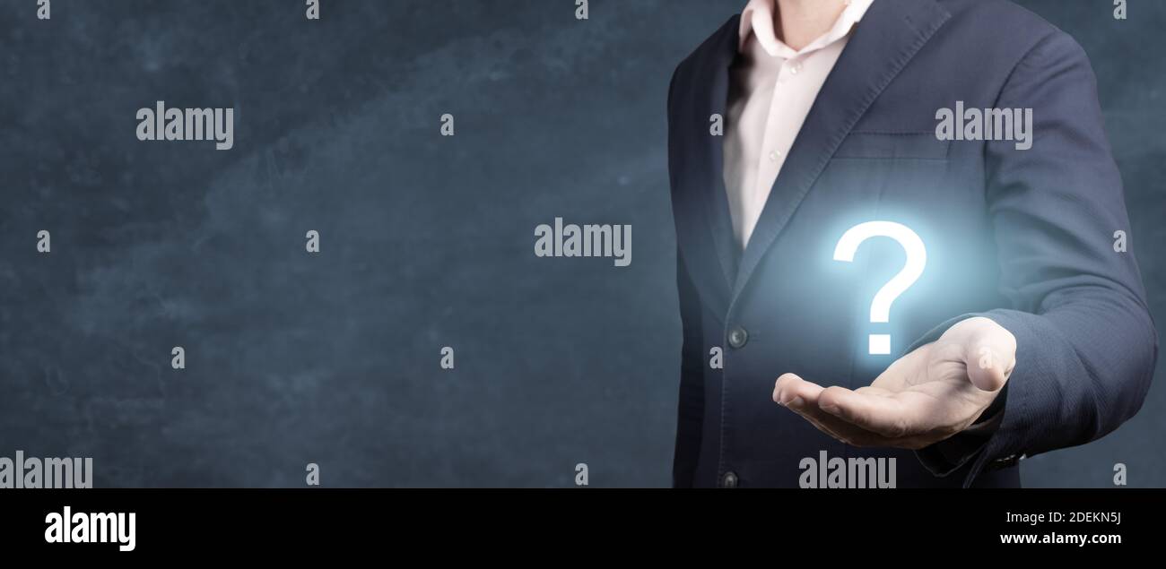 Businessman holding hand question marks in his hand. Businessman ...