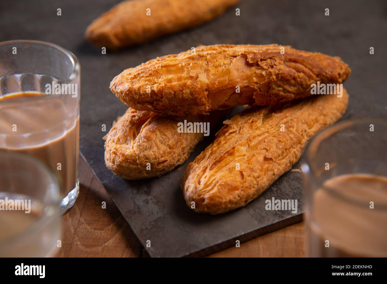 Glasses filled with tea kept next to fans Stock Photo - Alamy