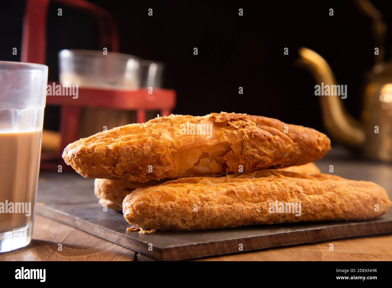Glasses filled with tea kept next to fans Stock Photo - Alamy