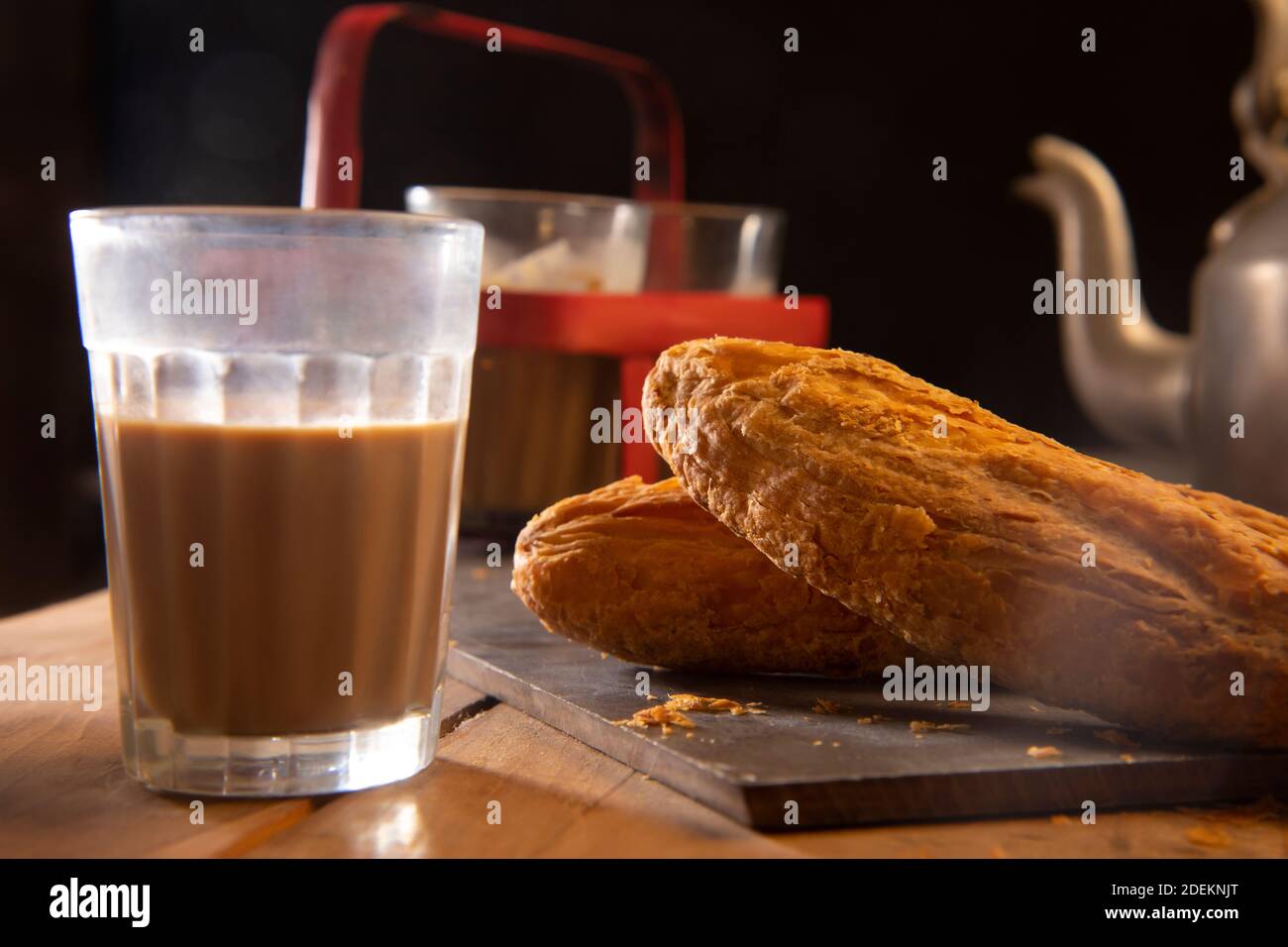 Glasses filled with tea kept next to fans Stock Photo - Alamy