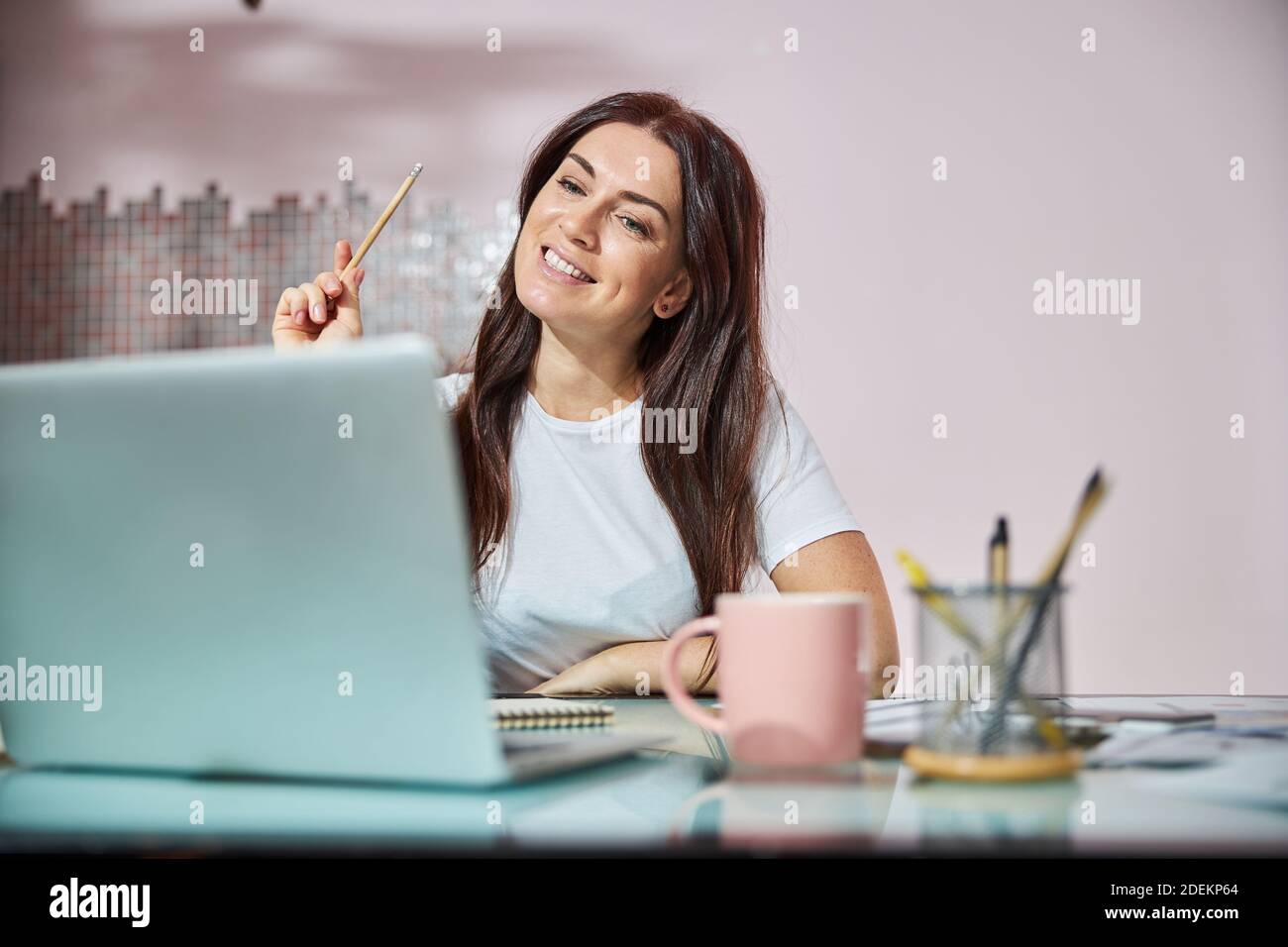 Female employee having an idea about her work Stock Photo - Alamy