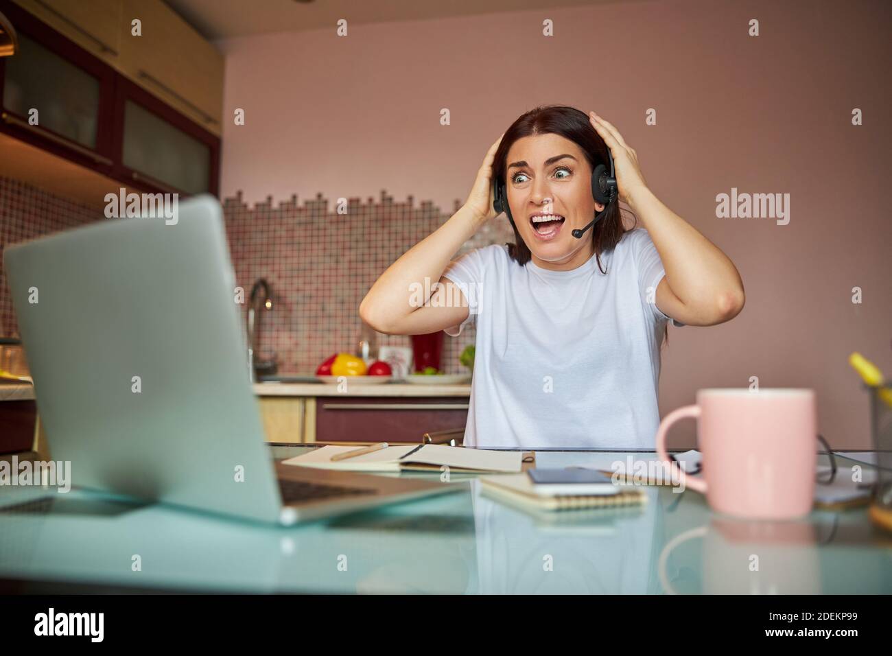 Scared female finding a big mistake in her work Stock Photo - Alamy
