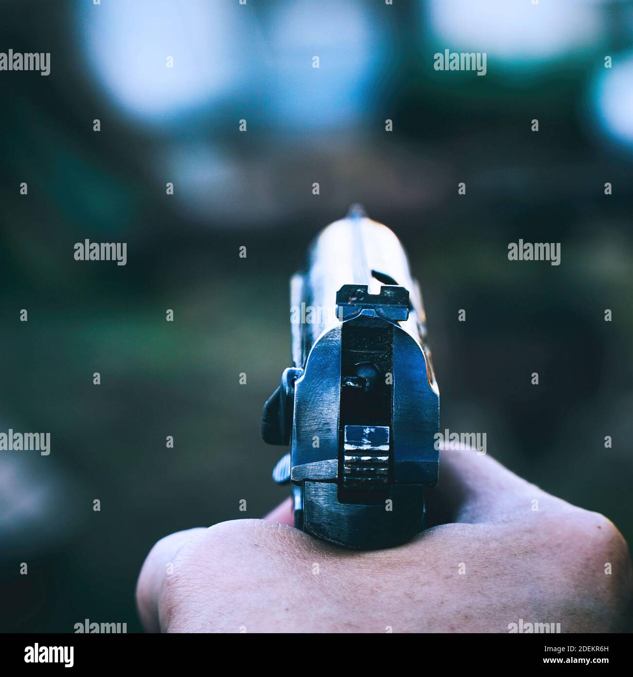 Gun in the hands of a man Stock Photo - Alamy