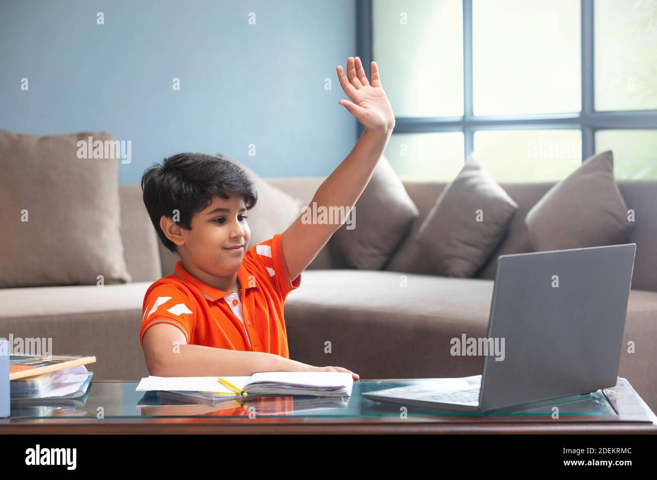 Boy raising hand class hi-res stock photography and images - Alamy