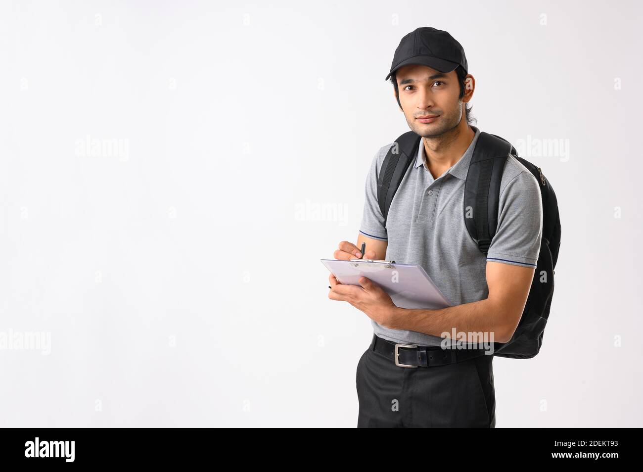 Courier boy writing the details after delivering the parcel Stock Photo ...