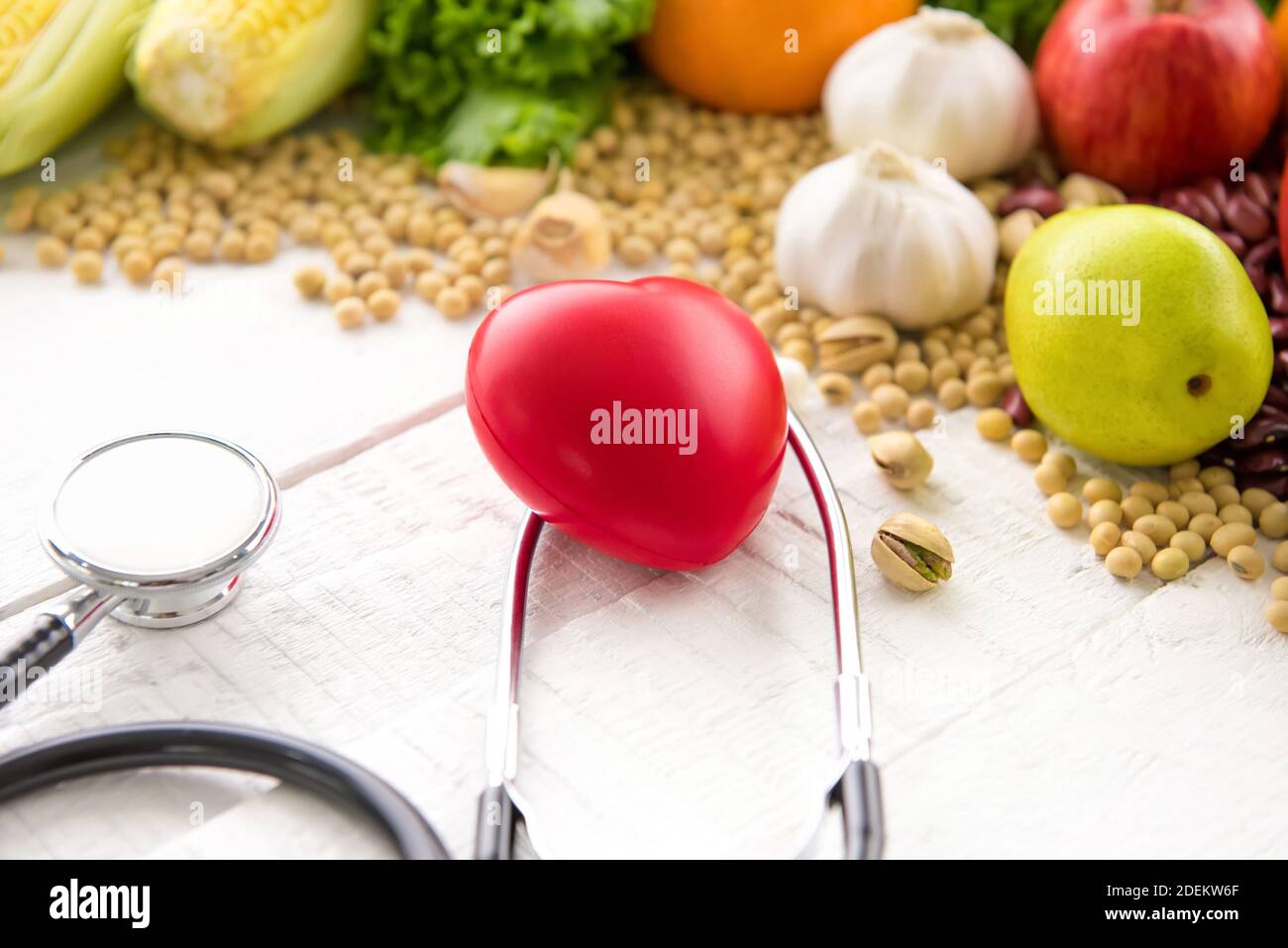 Colorful healthy medicinal fruits, vegetables, spices and nuts on white ...