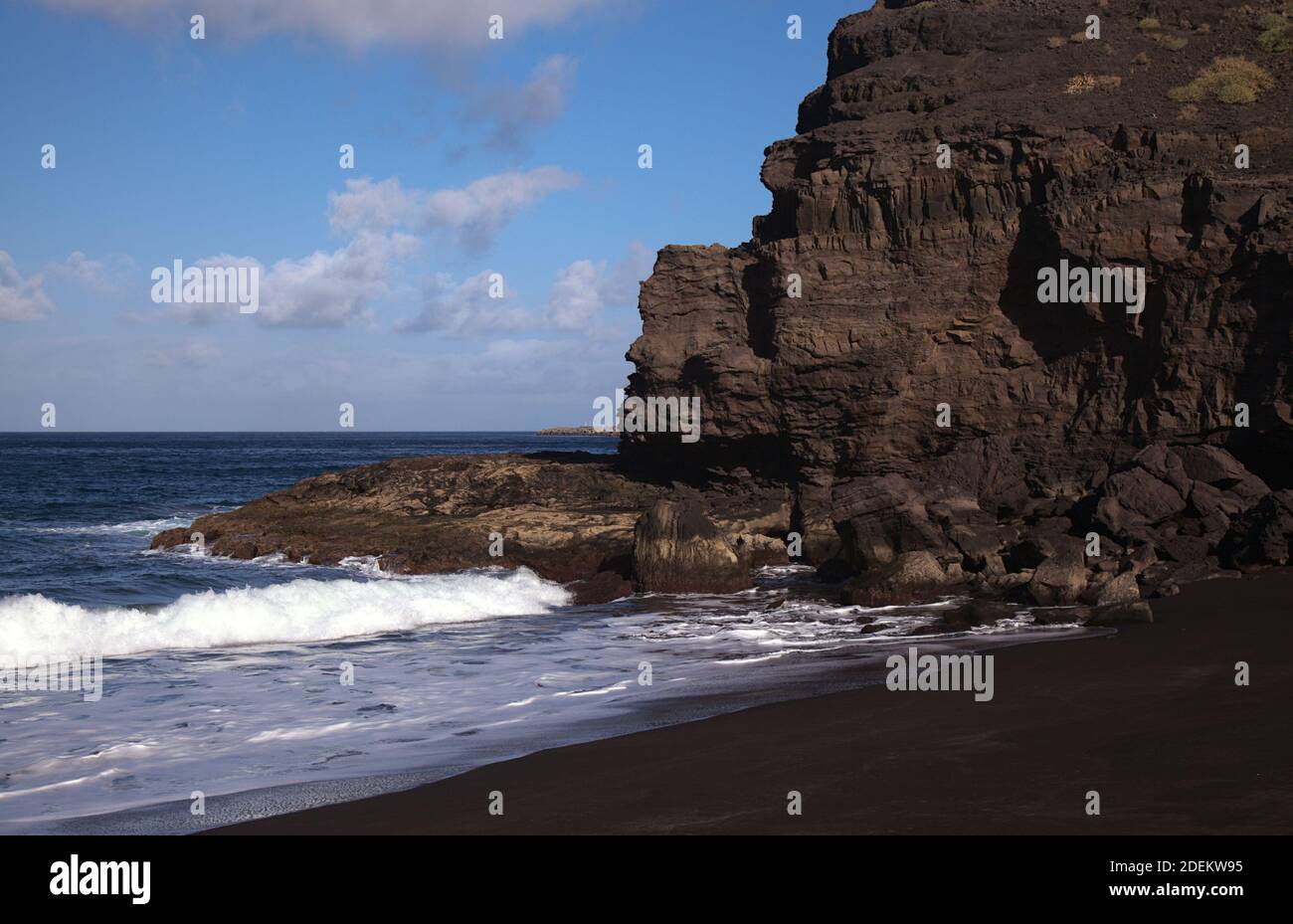 Gran Canaria, dark volcanic sand beach Playa de Guayedra in Agaete ...