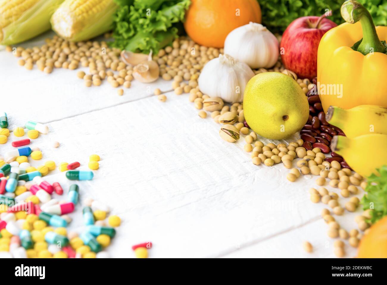 Colorful healthy medicinal fruits, vegetables, spices and nuts on white ...