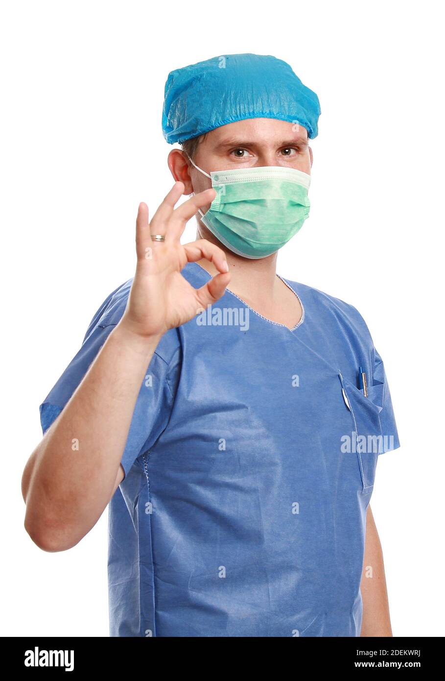 A young male surgeon showing the OK sign isolated on a white background ...