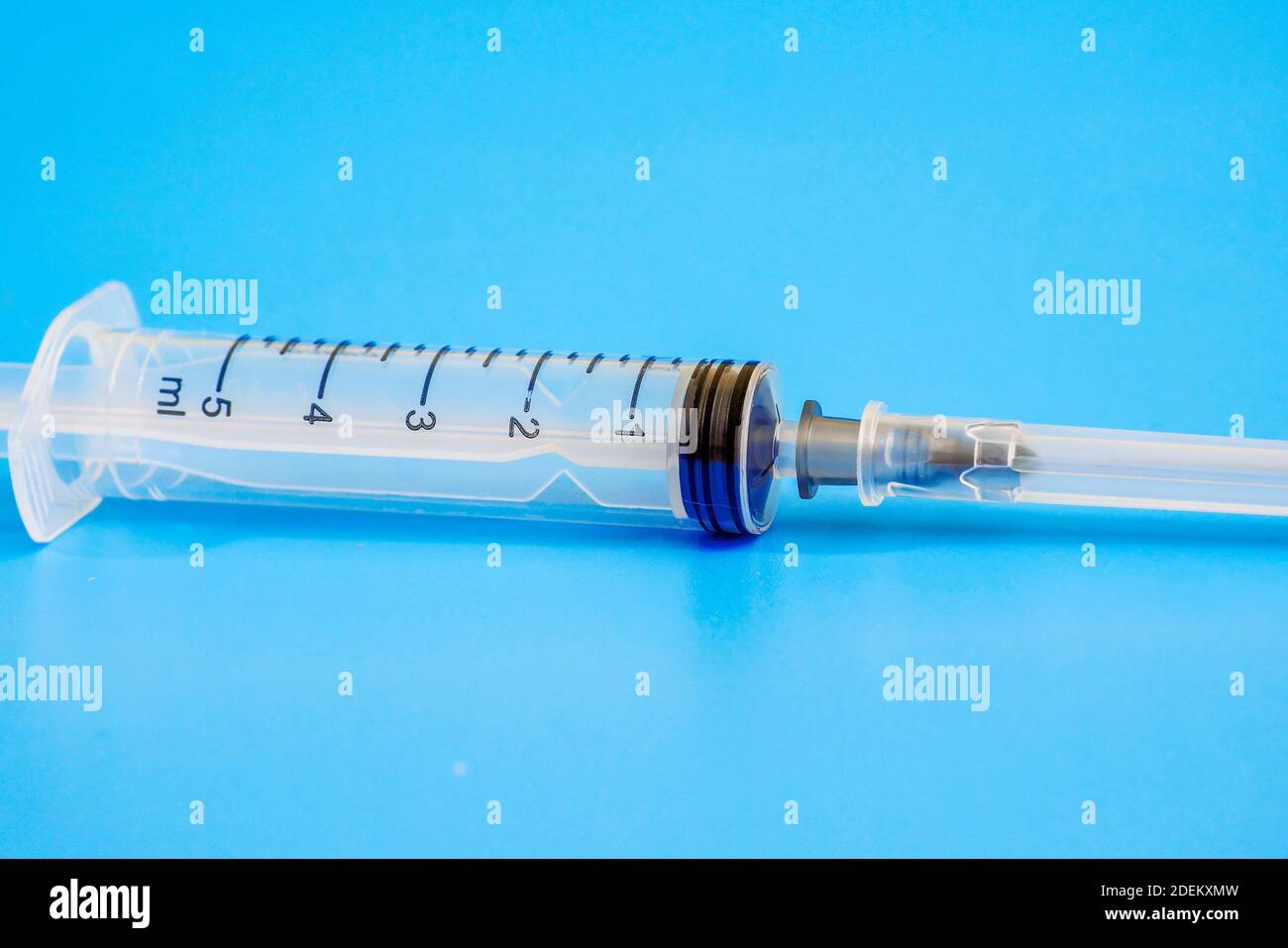 plastic disposable syringe on a blue background with copy space Stock ...