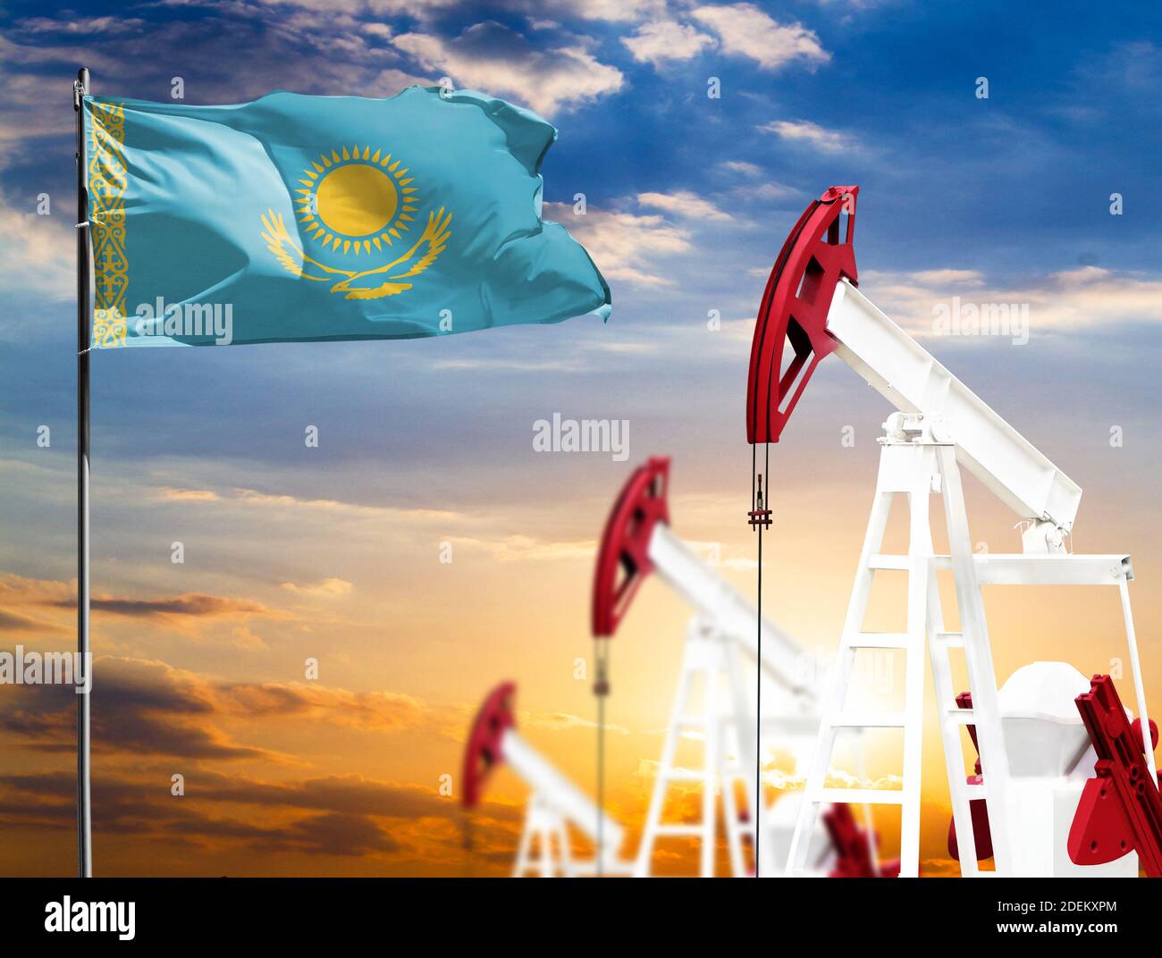 Oil rigs against the backdrop of the colorful sky and a flagpole with ...