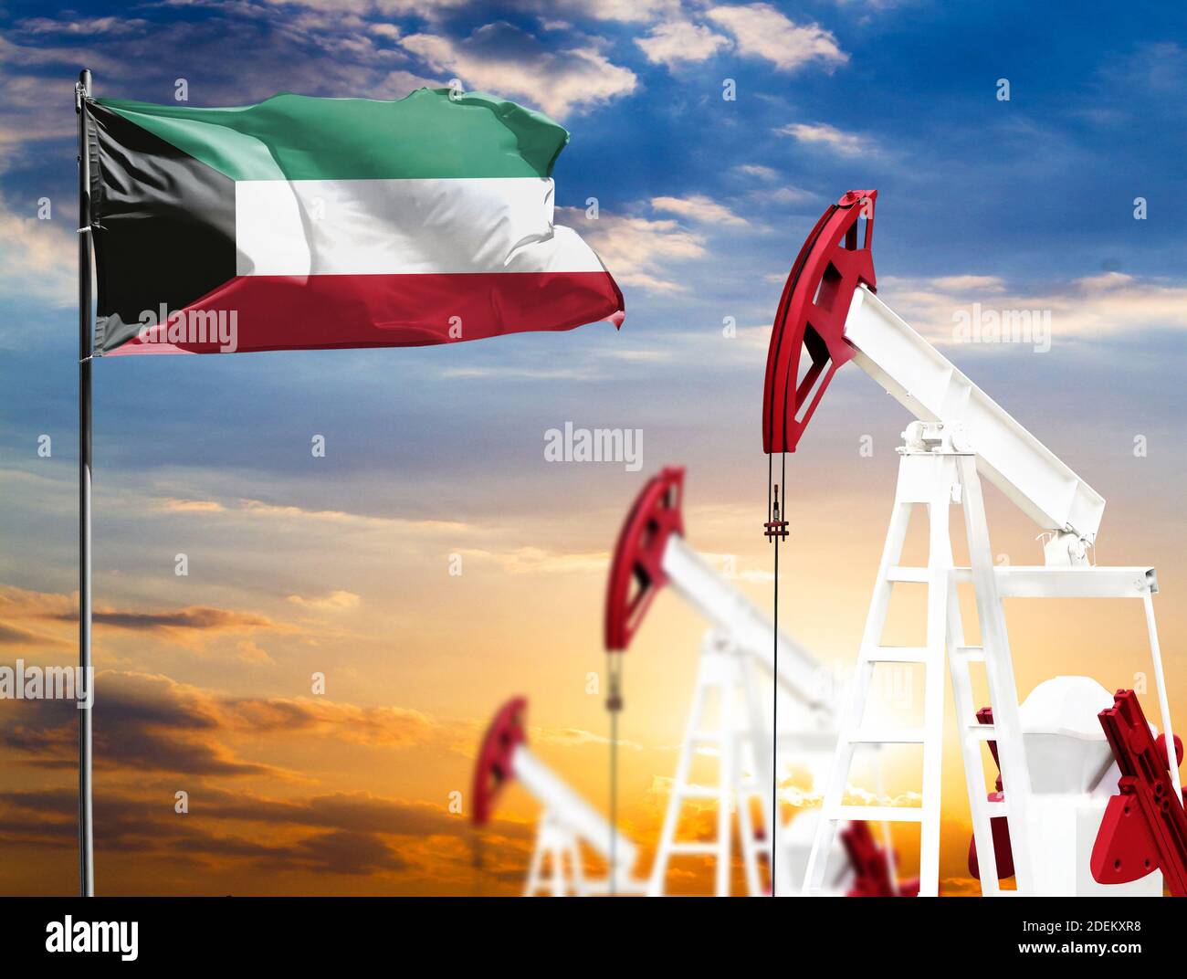 Oil rigs against the backdrop of the colorful sky and a flagpole with ...