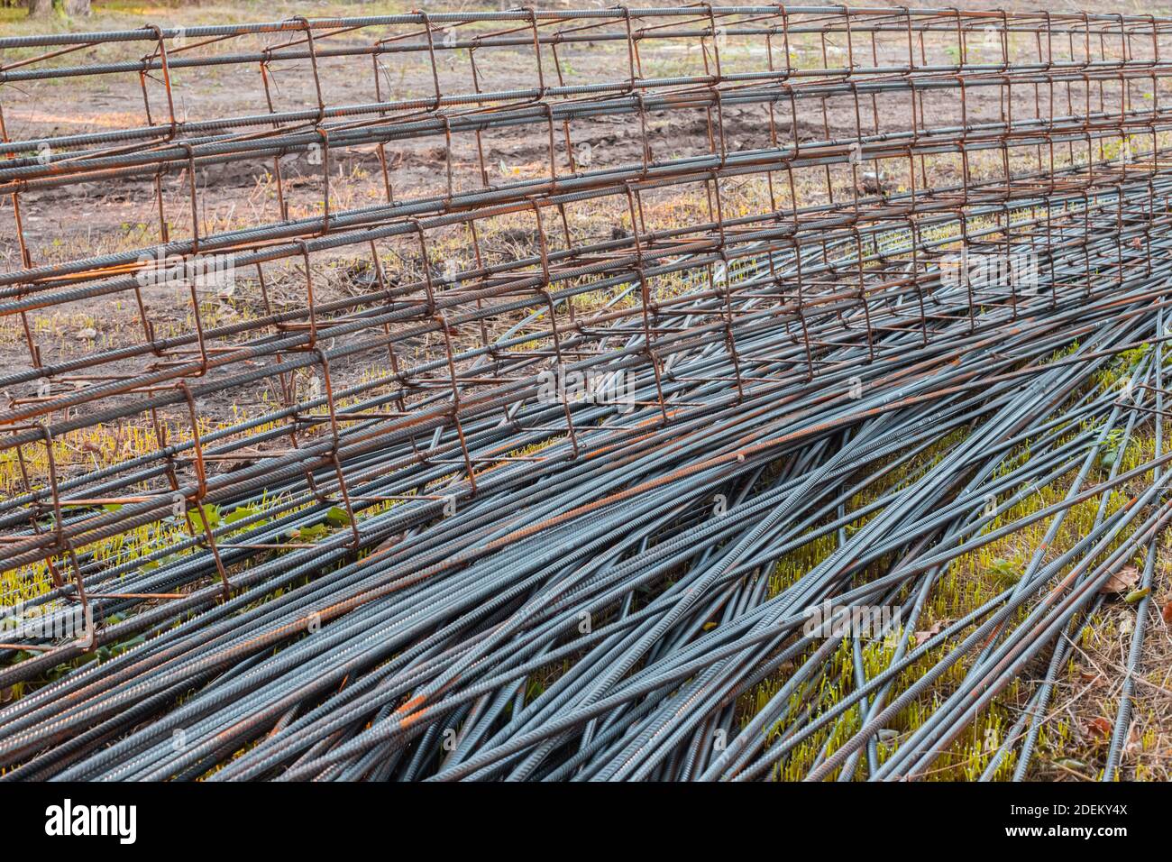 iron rebar twisted for building a house, neatly folded Stock Photo - Alamy