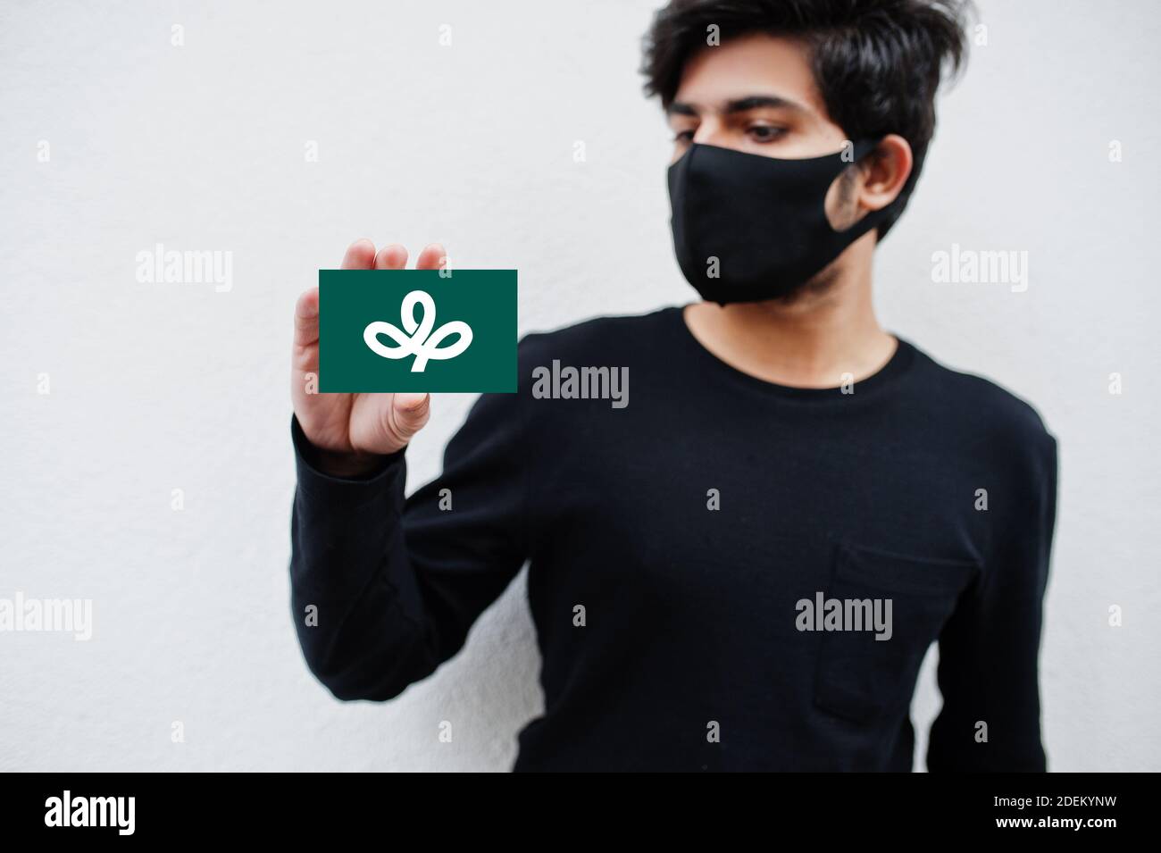 Japanese man wear all black with face mask hold Miyagi flag in hand ...