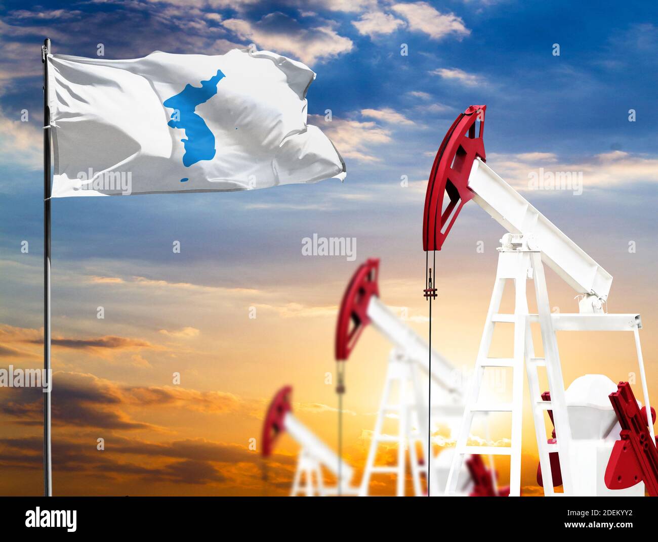 Oil rigs against the backdrop of the colorful sky and a flagpole with ...